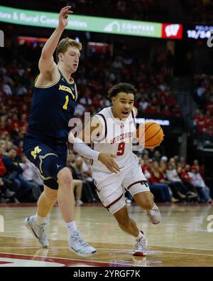 Michigan center Danny Wolf (1) drives the lane against Northwestern ...