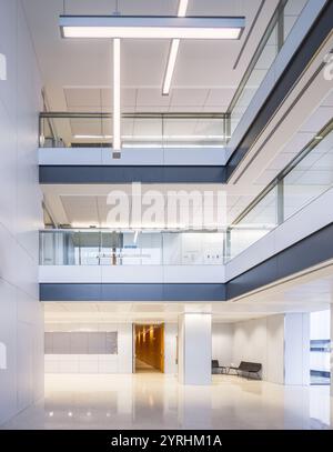 A modern hospital interior featuring bright, expansive corridors and ...
