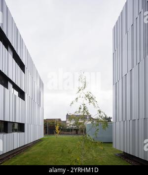 A contemporary hospital courtyard featuring sleek, minimalist ...