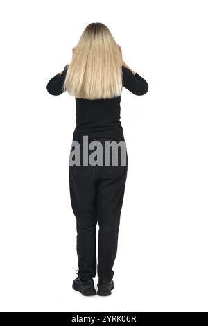 Slim woman covers her bare breasts isolated on a light background ...
