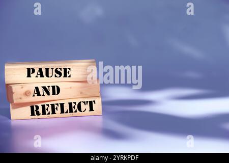 Pause and Reflect symbol. Concept words Pause and Reflect on wooden ...