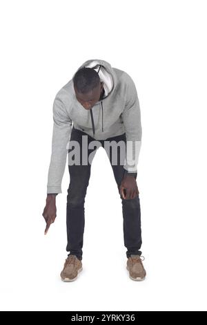 African American male model crouching like a gangster isolated on white ...