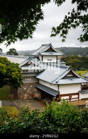 Traditional Japanese castle that is surrounded by lush greenery and ...