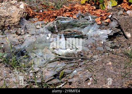 Trash waste litter broken glass jar on the ground in the country Stock ...