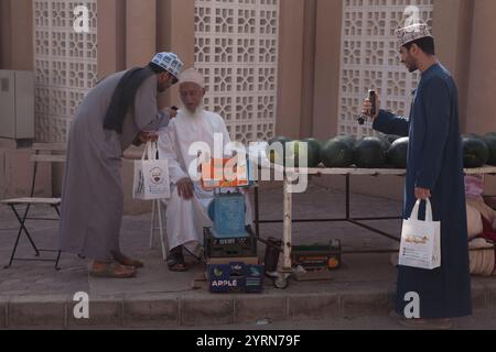 omani men shopping at watermelon stall outside nizwa suq nizwa oman ...