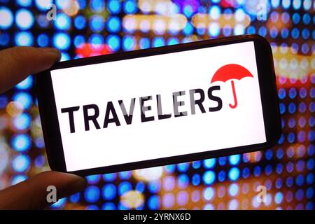 In this photo illustration, the Travelers Companies (commonly known as ...