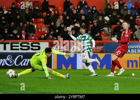 Celtic's Reo Hatate (centre) scores his sides first goal during the ...