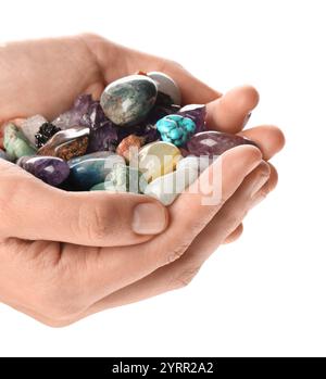 Woman holding different natural mineral stones on white background ...