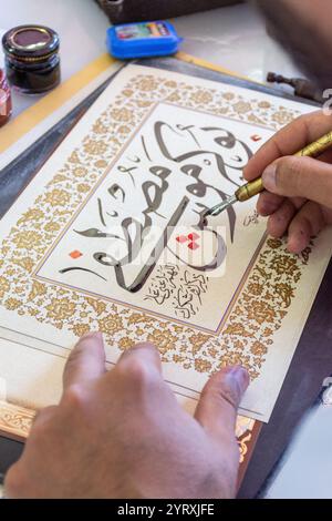 Arabic name for a customer in Arabic calligraphy with ink on a ...