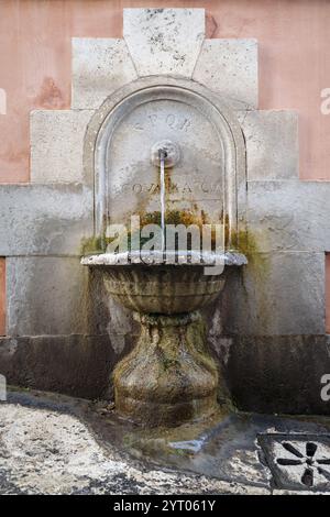 Typical ancient Roman drinking water fountain on street Stock Photo - Alamy