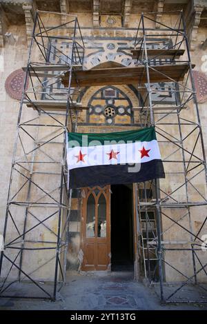 The flag of Hayat Tahrir al Sham, an extremist militant group active in ...