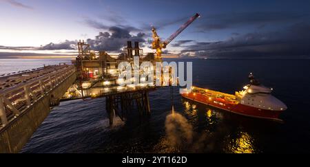North sea oil rig at night Stock Photo - Alamy
