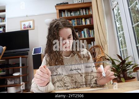 Teenager studying revising science biology cell structure GCSE drawing ...