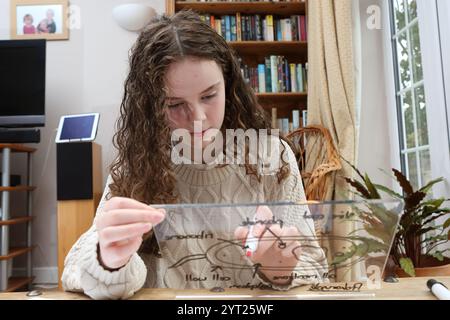 Teenager studying revising science biology cell structure GCSE drawing ...
