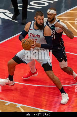 Dallas Mavericks center Daniel Gafford, right, grabs a rebound in front ...