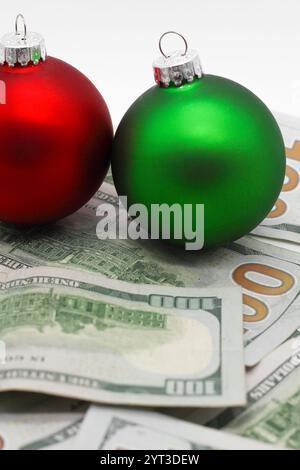 Colorful Christmas ornament on $100 dollar bills, isolated, holiday ...