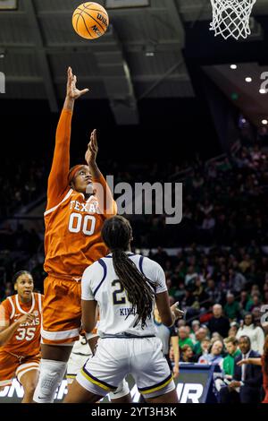 Texas forward Kyla Oldacre shoots over Penn center Tina Njike and guard ...