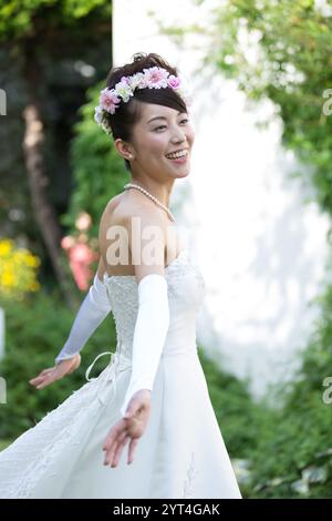 Beautiful woman in wedding dress in photo studio Stock Photo - Alamy