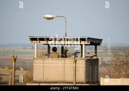 soldier with automatic rifle manning a lookout tower sentry post Stock ...
