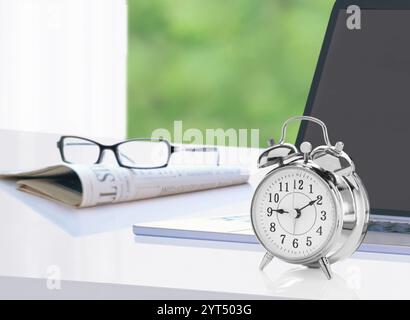 Alarm clock, computer and newspaper Stock Photo - Alamy