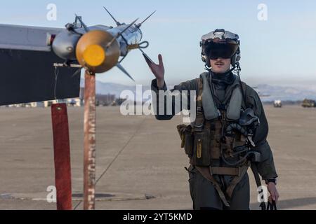 U.S. Marine Corps Capt. Lucas K. Leonhardt (left) and Capt. John A ...