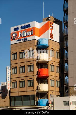 Niimi Company building with a jumbo cook sculpture on the roof on ...