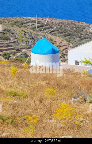 Traditional windmill overlooking Sifnos coast, Sifnos Island, Cyclades ...