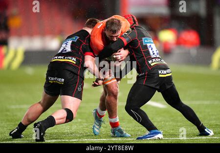 Edinburgh's Tom Dodd is tackled by Gloucester's Mike Austin during the ...