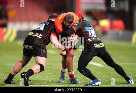 Edinburgh's Tom Dodd is tackled by Gloucester's Mike Austin during the ...