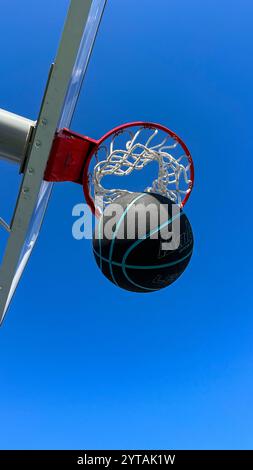 Basketball falling through the net Stock Photo - Alamy