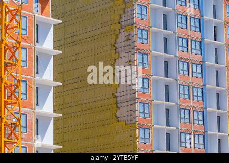 Cladding and warming wall of monolithic house under construction ...