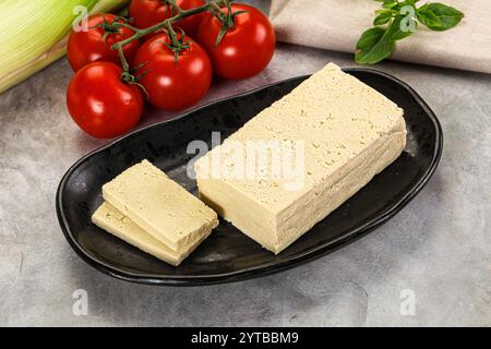 Soya vegan tofu cheese brick over board Stock Photo - Alamy
