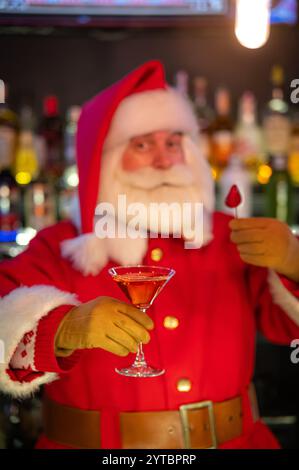 Santa Claus drinking a cocktail at a bar Stock Photo - Alamy