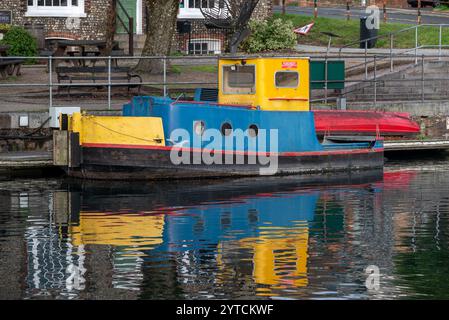 Brightly painted tug boat moored on Chichester canal. December 2024 ...