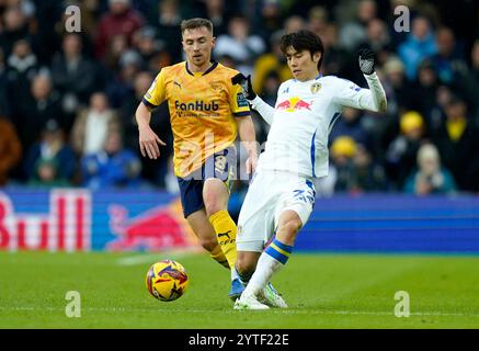 Derby County's Ben Osborn (left) speaks with referee Adam Herczeg ...
