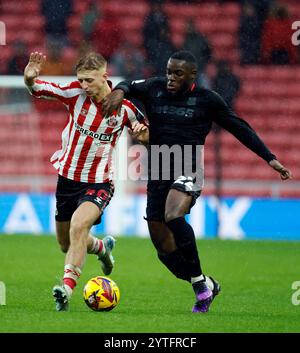 Stoke City's Junior Tchamadeu (left) and Coventry City's Ephron Mason ...