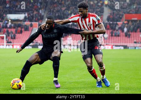 Stoke City's Junior Tchamadeu (left) and Coventry City's Ephron Mason ...