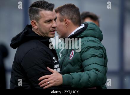 Reading manager Noel Hunt (left) greets Tottenham Hotspur manager ...