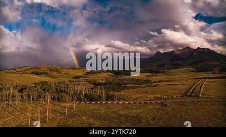 SEPTEMBER, 2024, RIDGWAY, COLORADO - rainbow over Aspens and San Juan ...