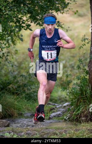 Runners on the Kilnsey Crag fell race held at the Kilnsey Show in the ...