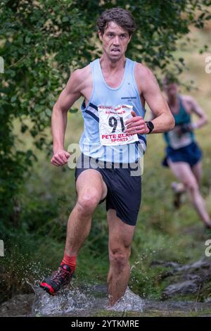 Runners on the Kilnsey Crag fell race held at the Kilnsey Show in the ...