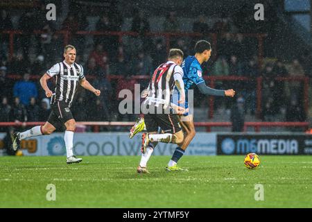Morecambe FC's Marcus Dackers under pressure fromBen Thompson of ...