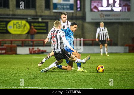 Morecambe FC's Marcus Dackers under pressure from Kamarl Grant of ...
