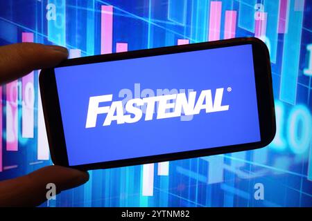 In this photo illustration, the Fastenal logo is seen on a smartphone ...