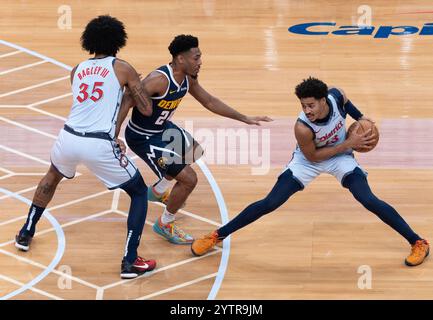 Denver Nuggets guard Jalen Pickett (24) and San Antonio Spurs guard ...