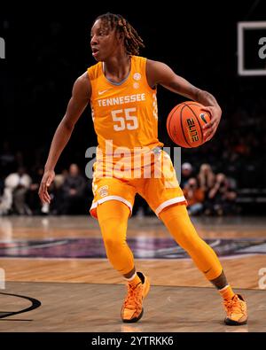 Tennessee guard Talaysia Cooper (55) drives for a shot as she's dfended ...