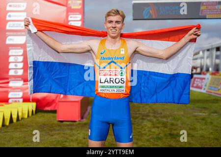 Niels Laros, of the Netherlands, poses after winning the men 1500 ...