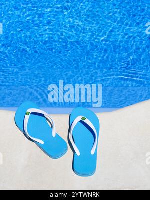 Flip flops or Slippers on the edge of a swimming pool Stock Photo - Alamy