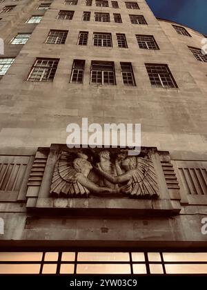 BBC Building Sculpture By Eric Gill Stock Photo - Alamy