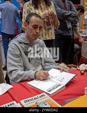 The cartoonist Zerocalcare (Michele Rech) signing a book at "Più Libri ...